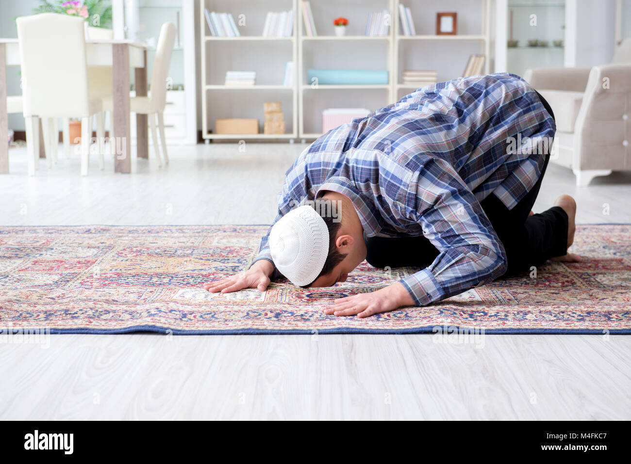 Muslim man praying at home Stock Photo - Alamy