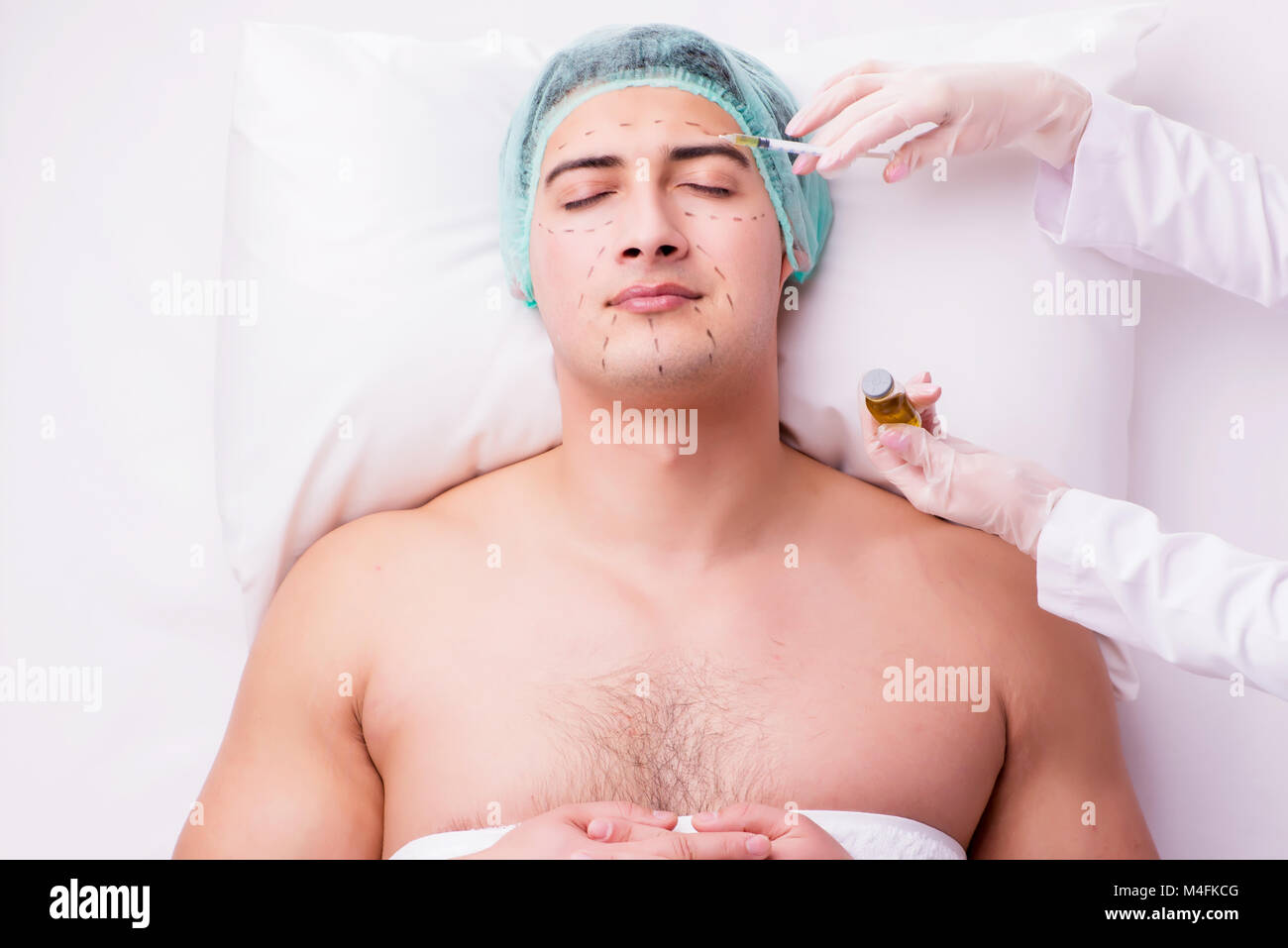 Handsome man in spa massage concept Stock Photo - Alamy