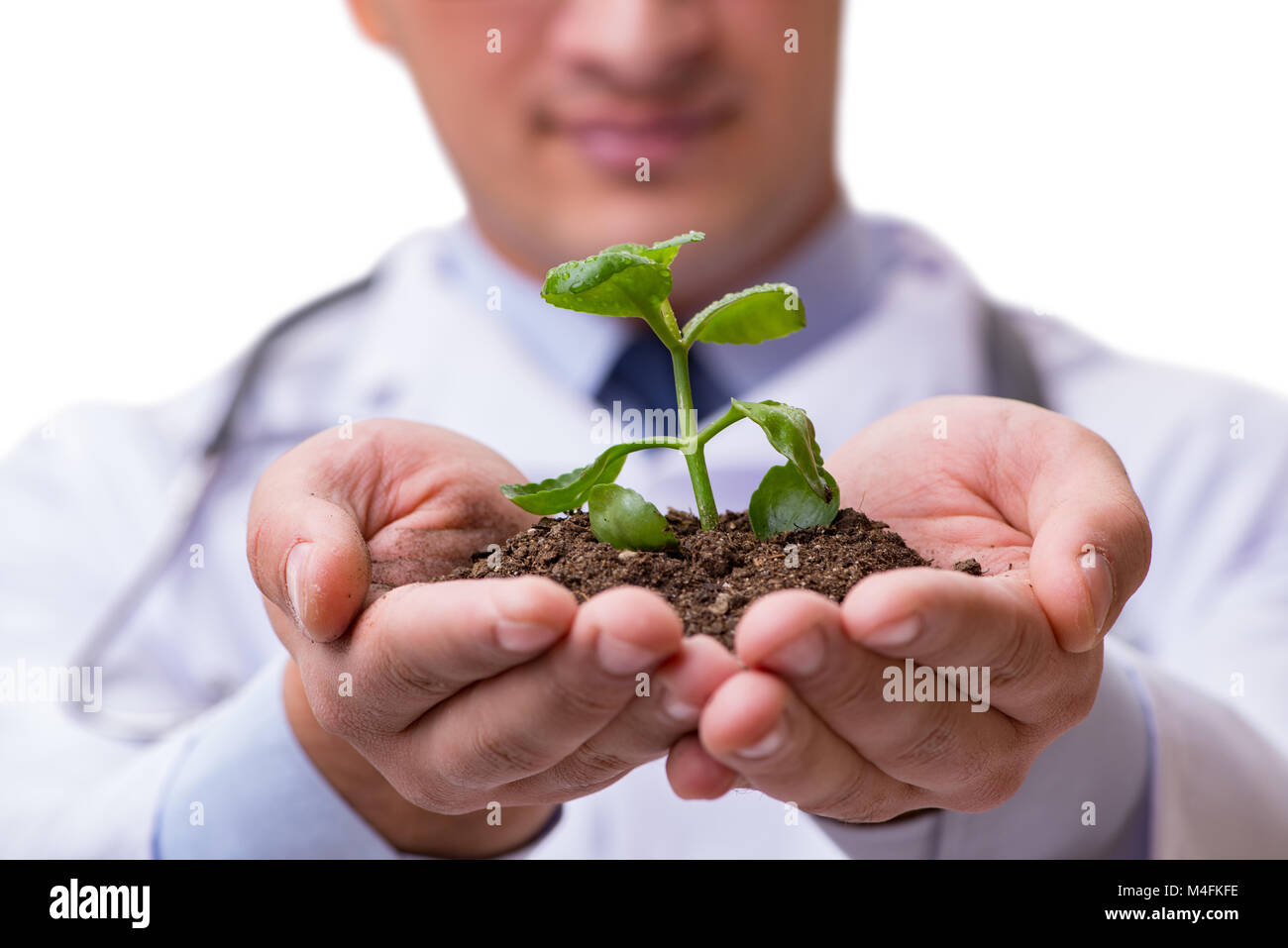 Scientist with green seedling in glass isolated on white Stock Photo ...