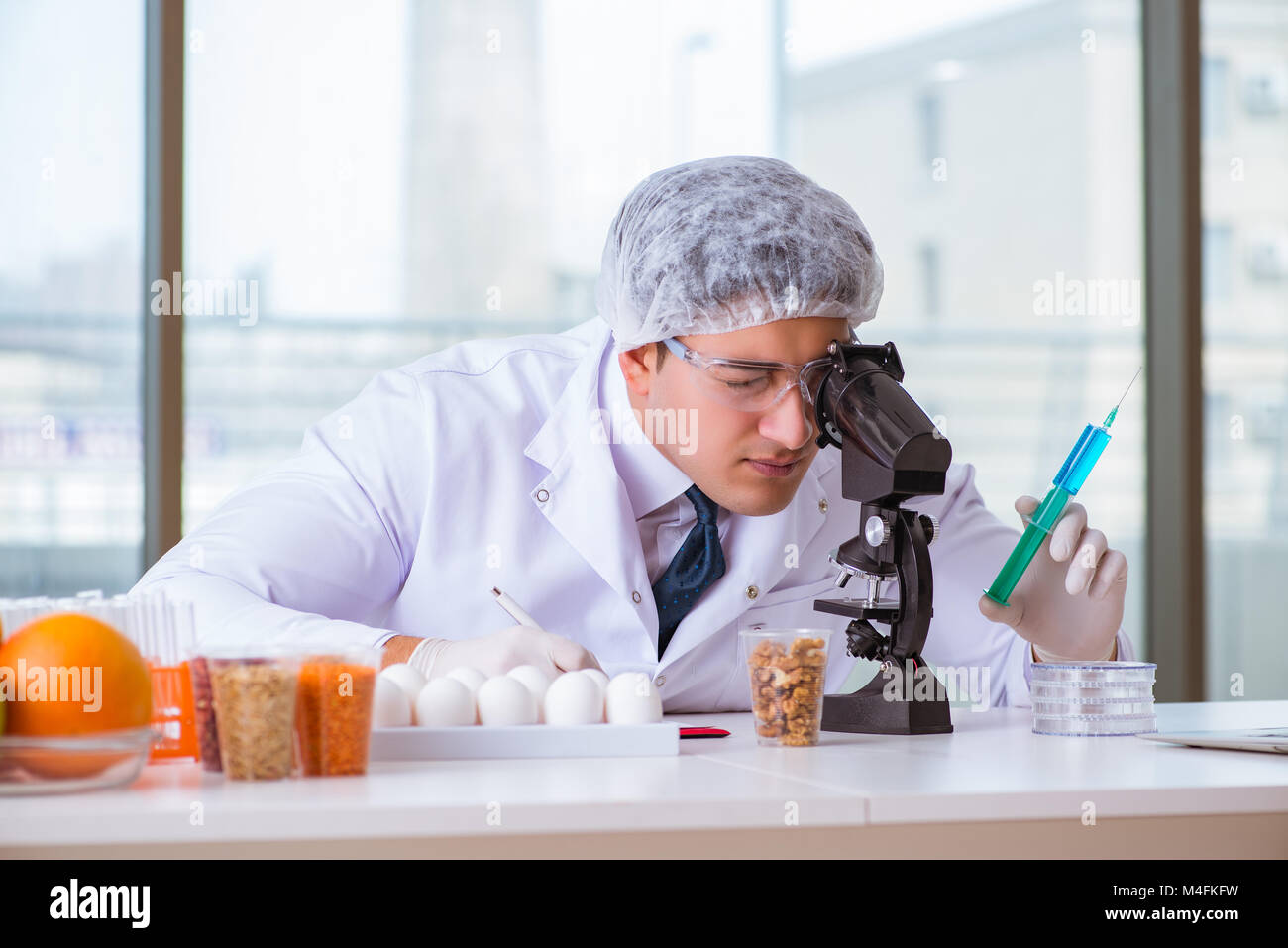 Nutrition expert testing food products in lab Stock Photo - Alamy