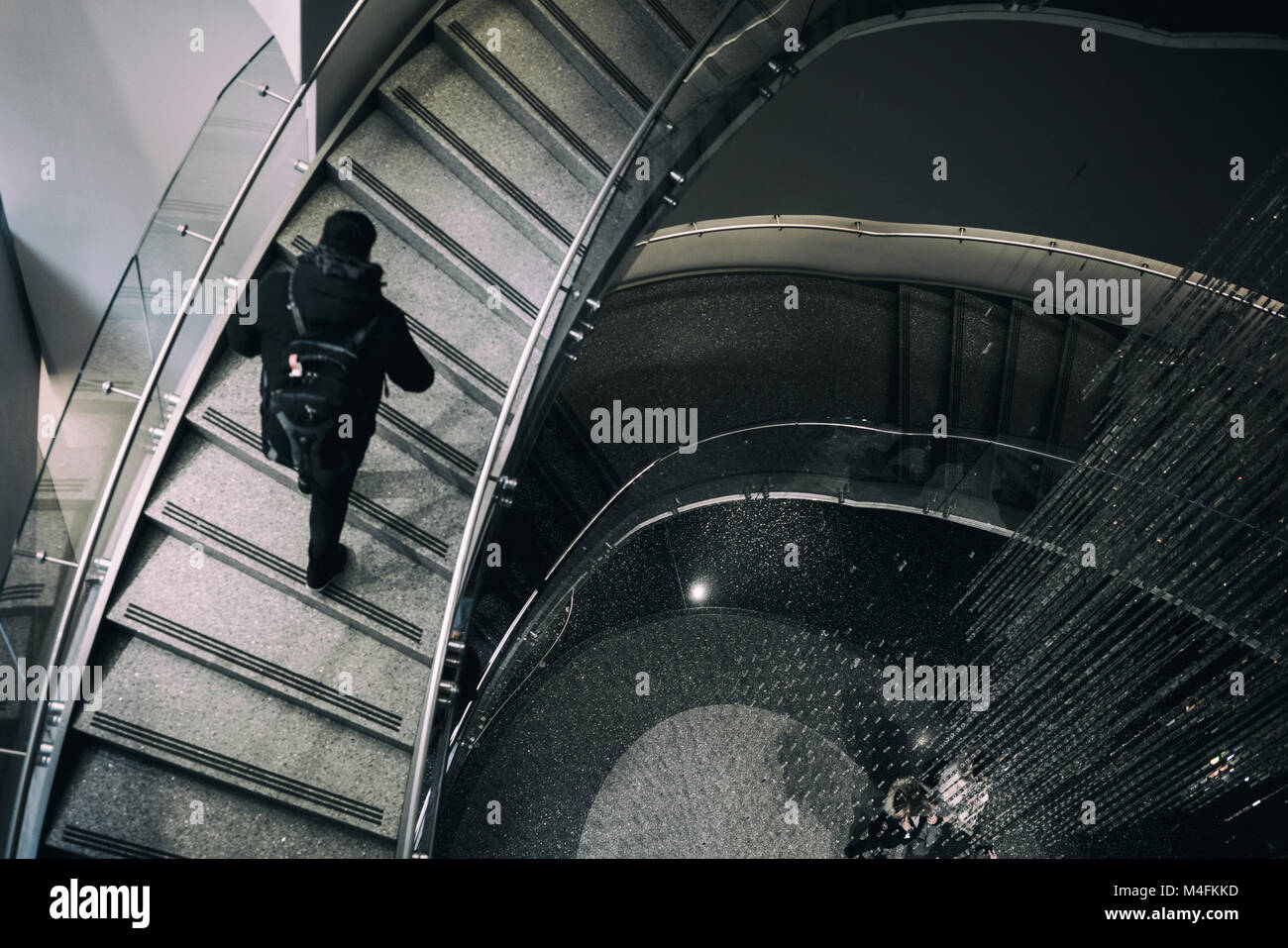 man climbing building stairs seen from above Stock Photo - Alamy