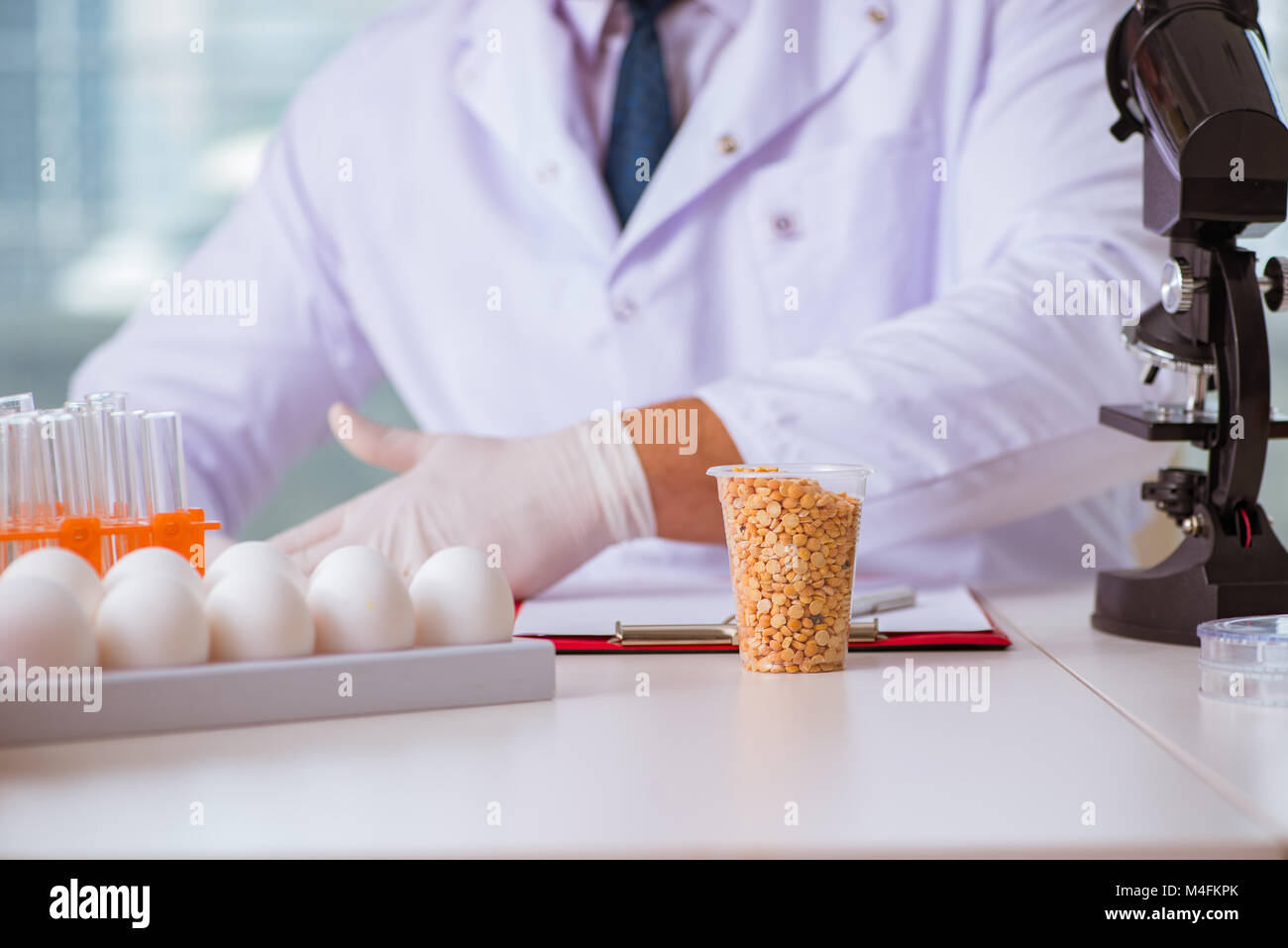 Nutrition expert testing food products in lab Stock Photo - Alamy