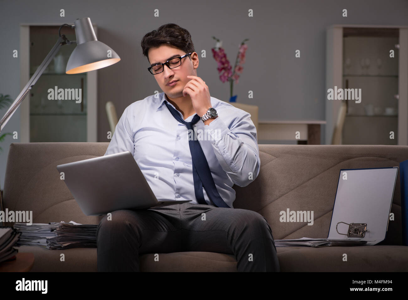 Businessman workaholic working late at home Stock Photo - Alamy