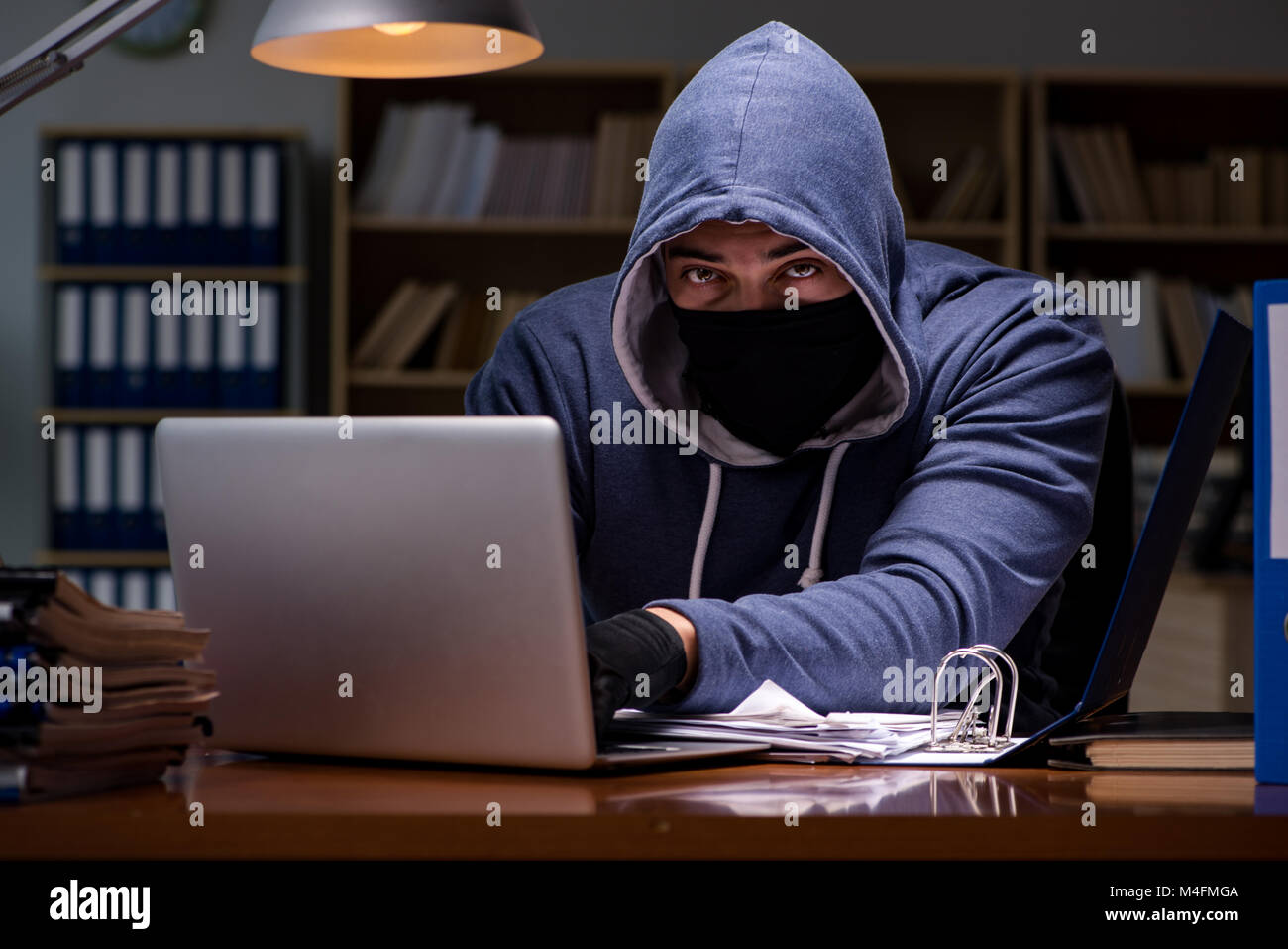 Hacker stealing personal data from home computer Stock Photo - Alamy