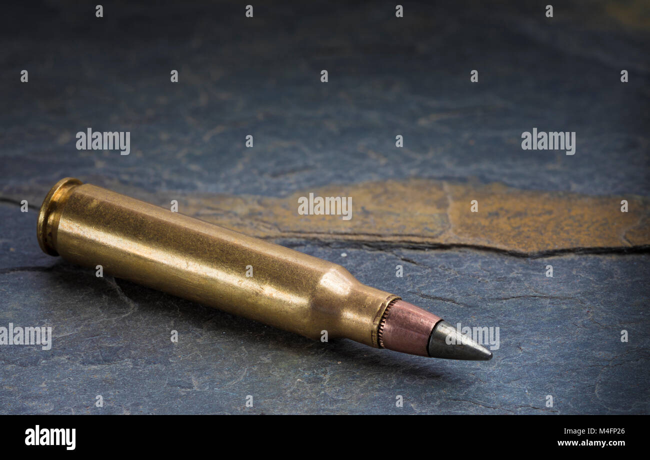 New M855 EPR cartridge with a grey stone background Stock Photo - Alamy