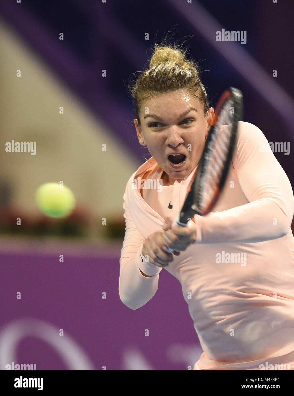 Doha, Qatar. 15th Feb, 2018. Simona Halep of Romania hits a return ...