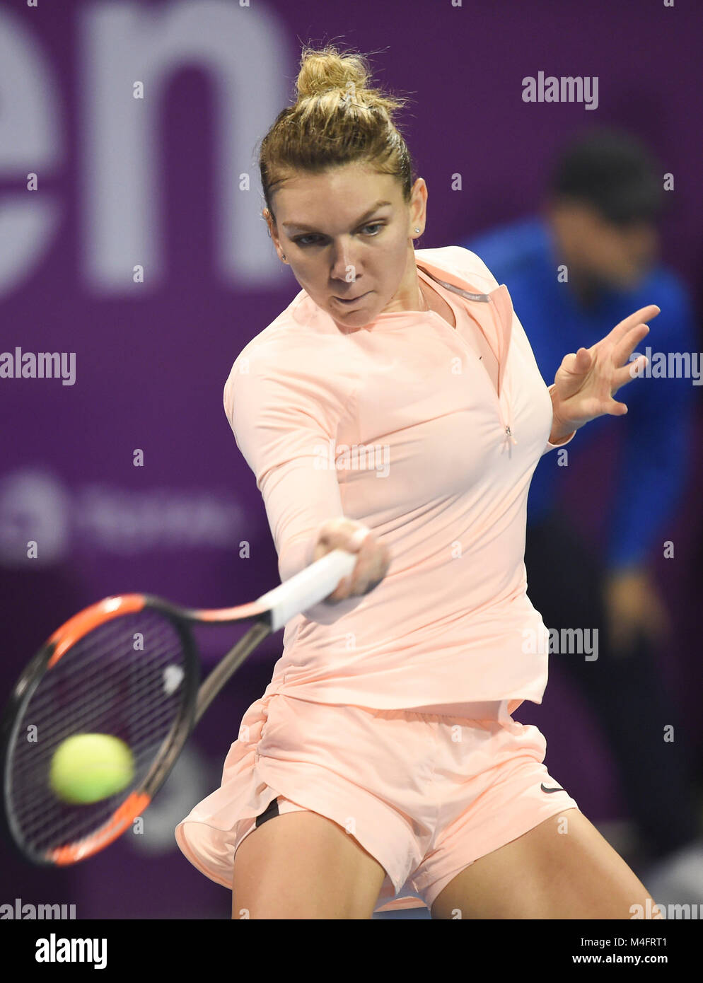 Doha, Qatar. 15th Feb, 2018. Simona Halep of Romania hits a return ...