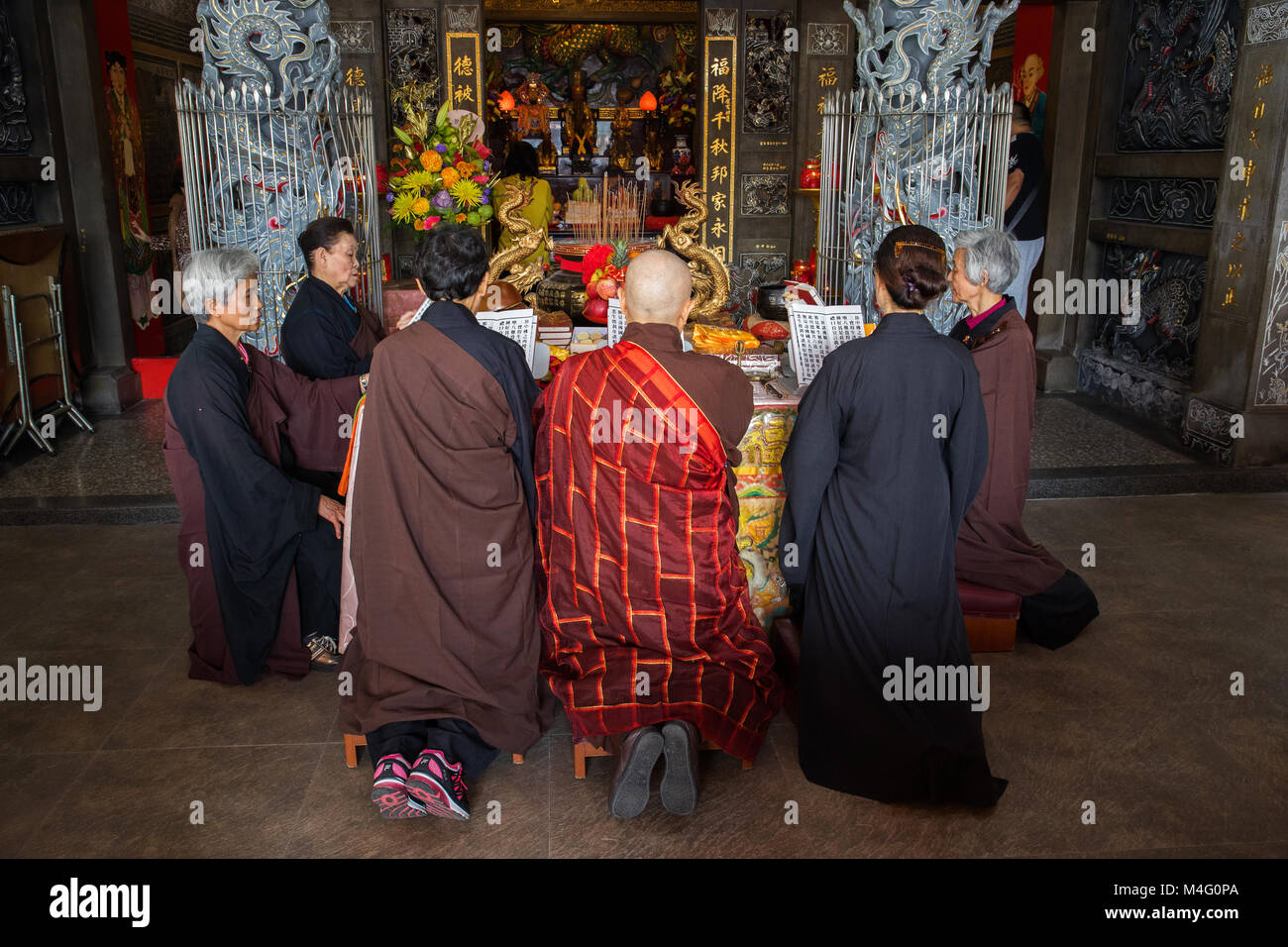 Taipei, Taiwan, 16 Feb. 2018: A Daoist master and nuns pray at the ...