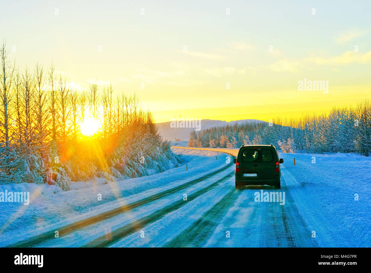 Car driving on the icy plateau at sunset in winter in Iceland Stock ...