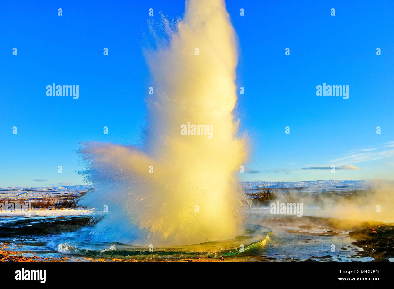 Eruption of Strokkur Geyser in winter, where is on the popular route of ...