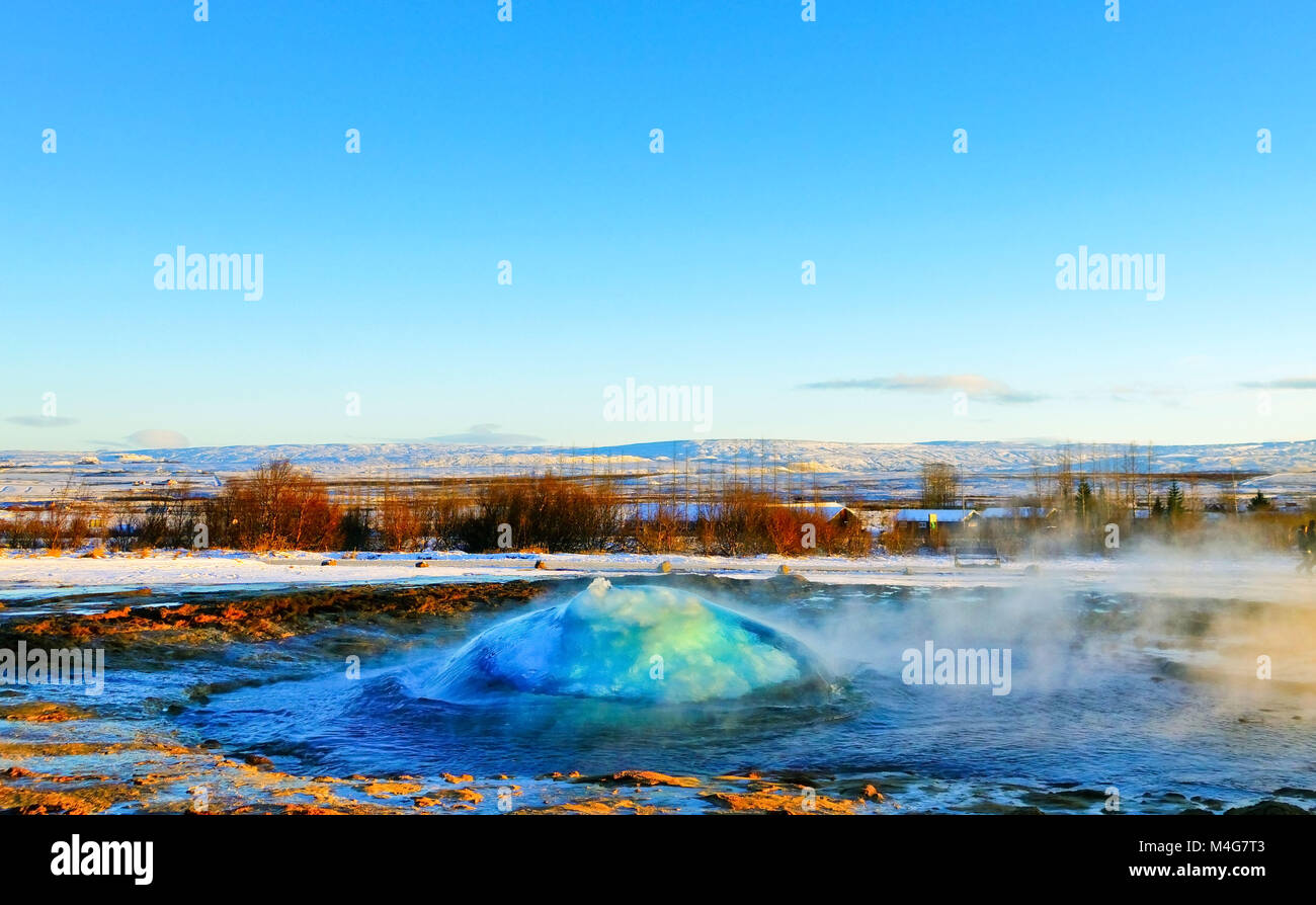 Eruption of Strokkur Geyser in winter, where is on the popular route of ...