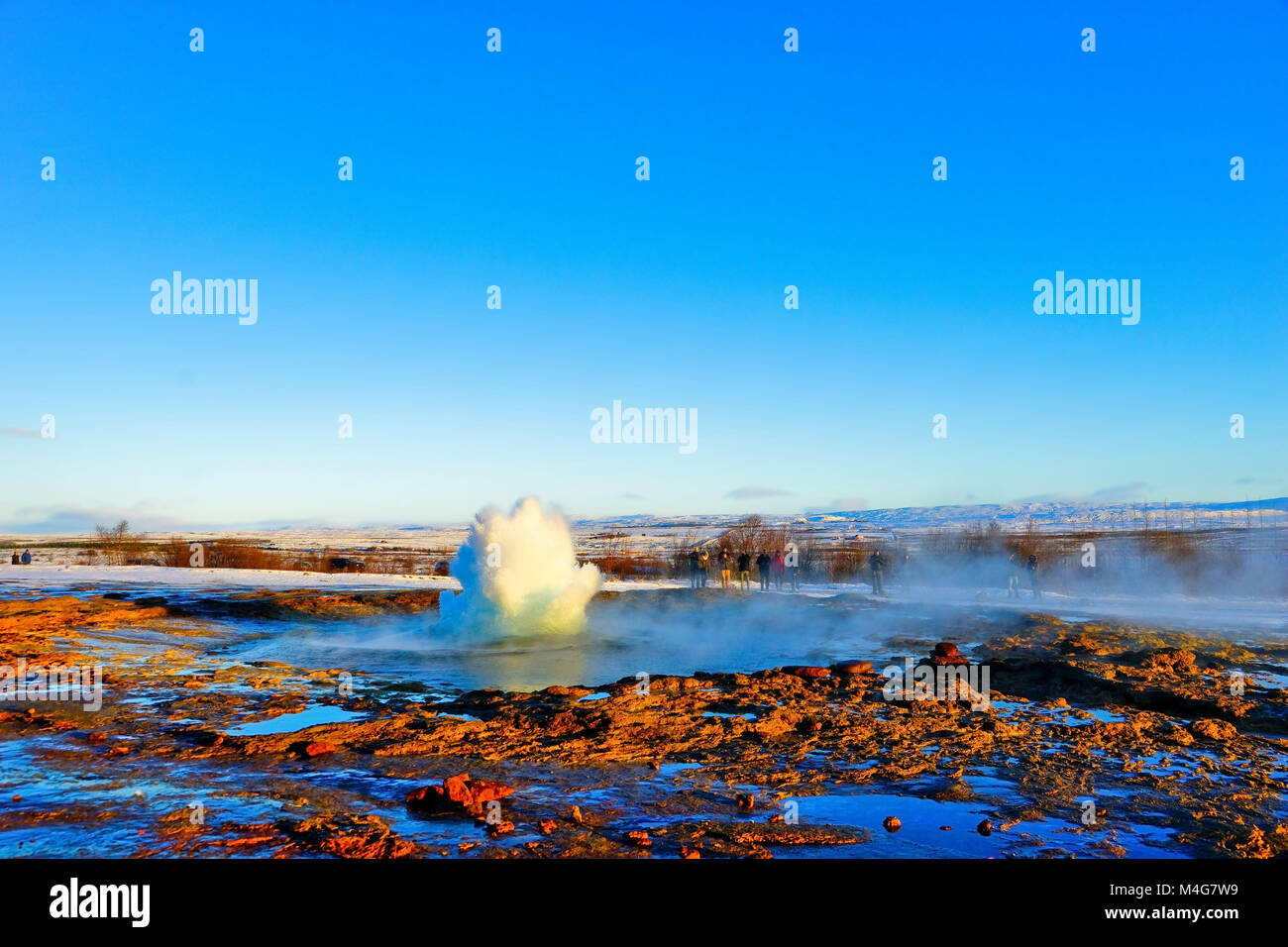 Eruption of Strokkur Geyser in winter, where is on the popular route of ...