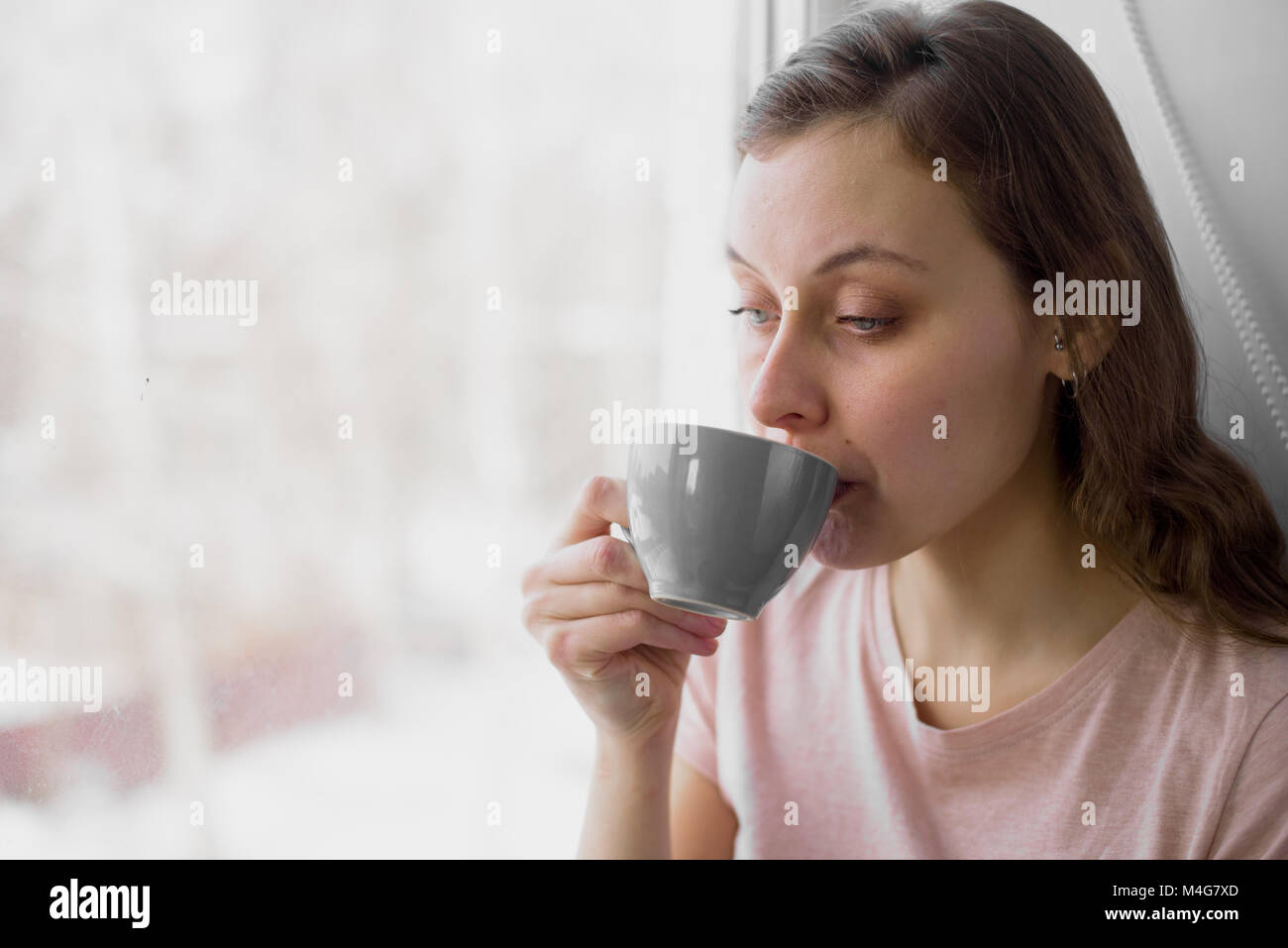 Beautiful woman drinking tea in the morning Stock Photo - Alamy