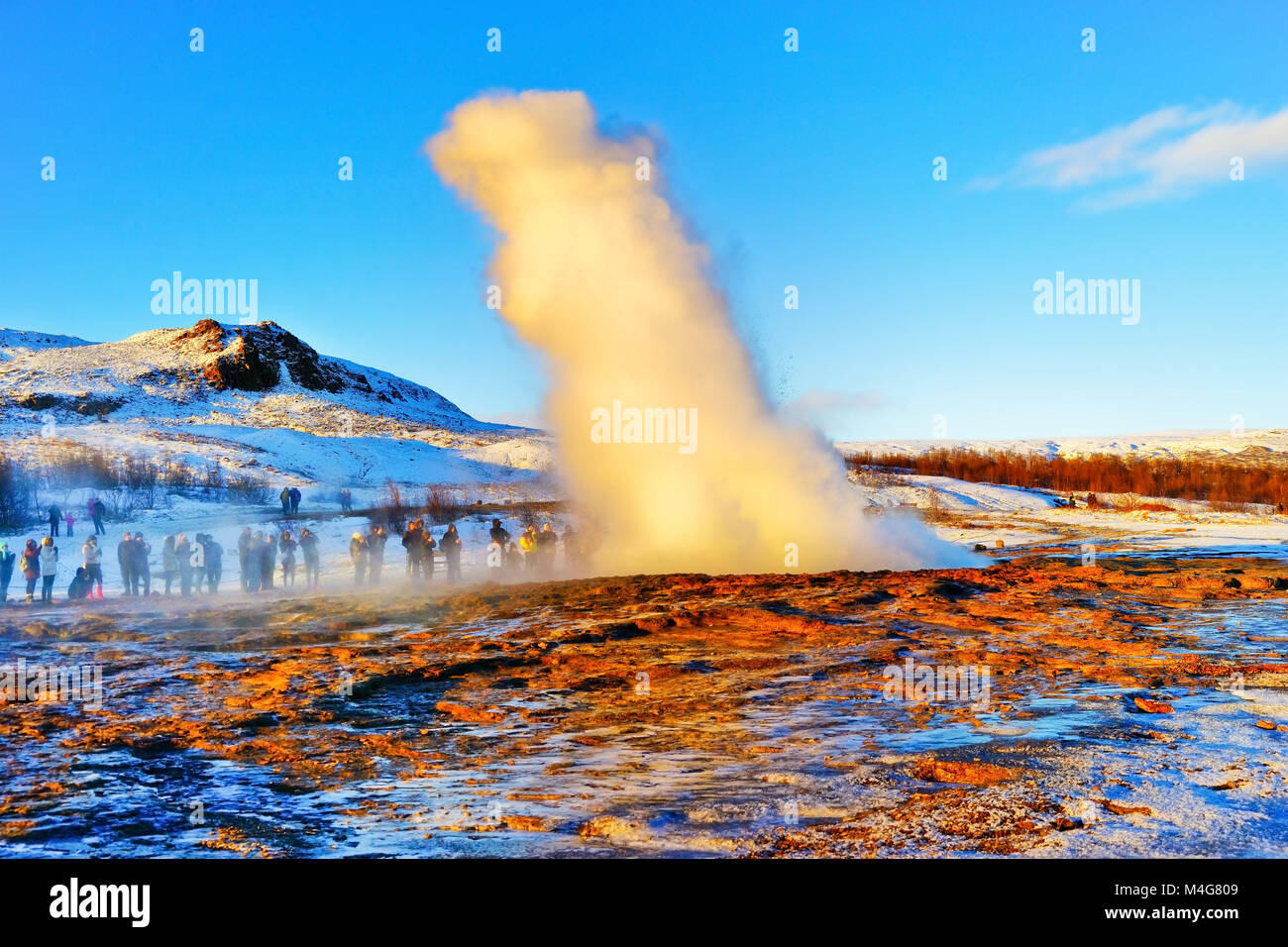 Eruption of Strokkur Geyser in winter, where is on the popular route of ...