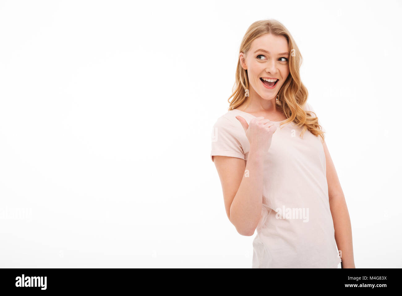 Picture of cute young smiling lady standing isolated over white ...