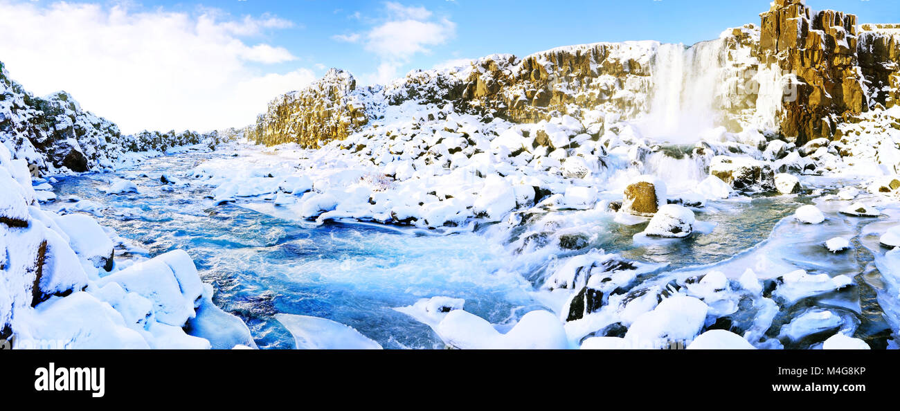View of Oxararfoss waterfall in winter at Thingvellir National Park in ...