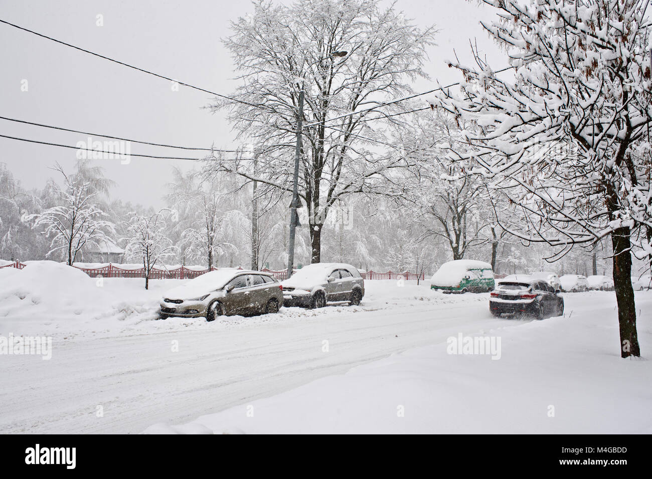 Cars on the road in the snowfall Stock Photo - Alamy