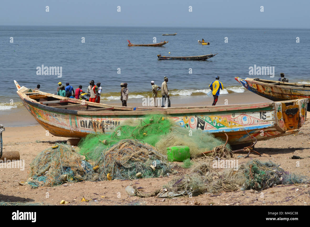 Artisanal wooden fishing boats (pirogues) in the Petite Côte, Senegal ...