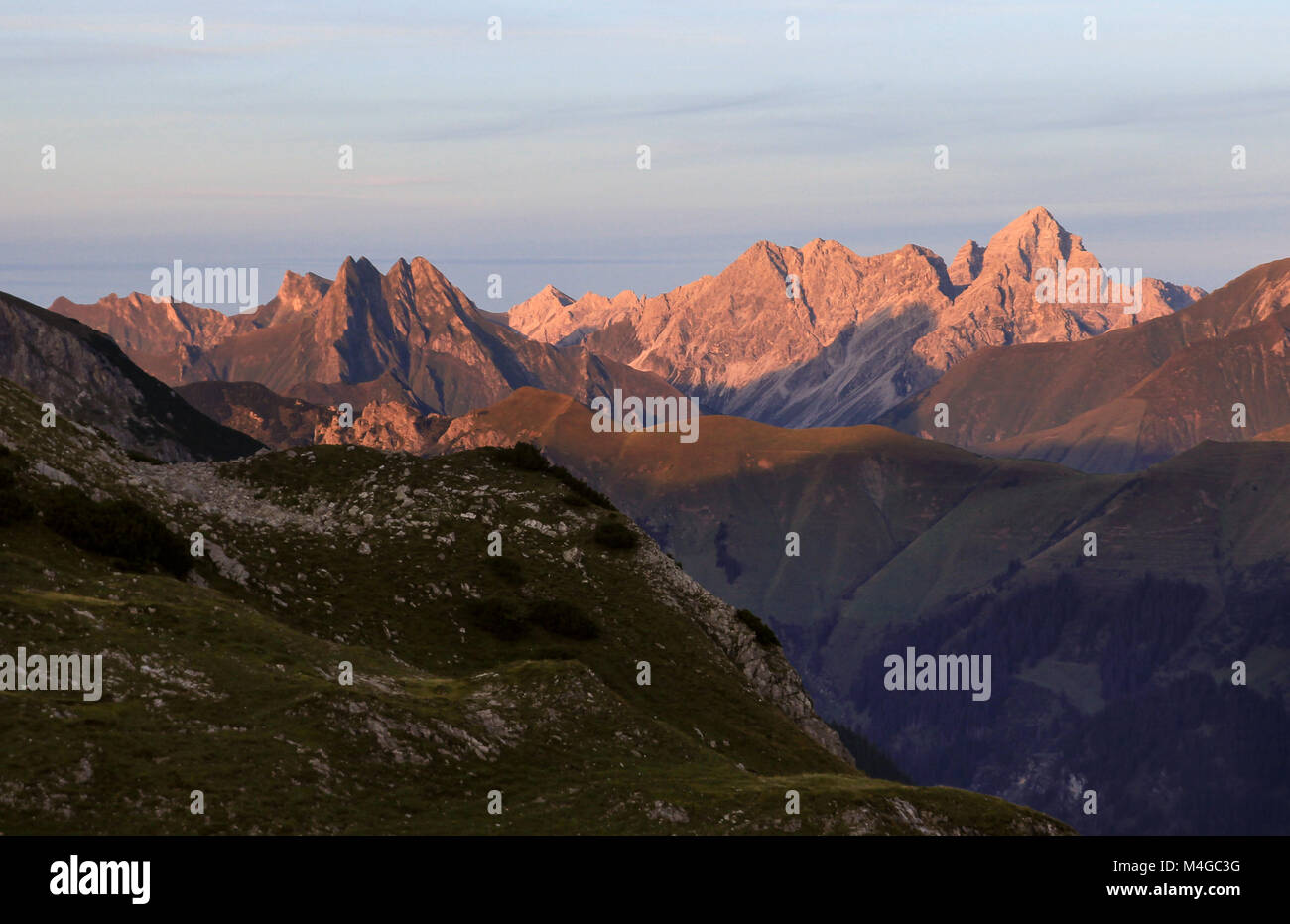 Great view from high mountain to many other peaks. Sunset Stock Photo ...
