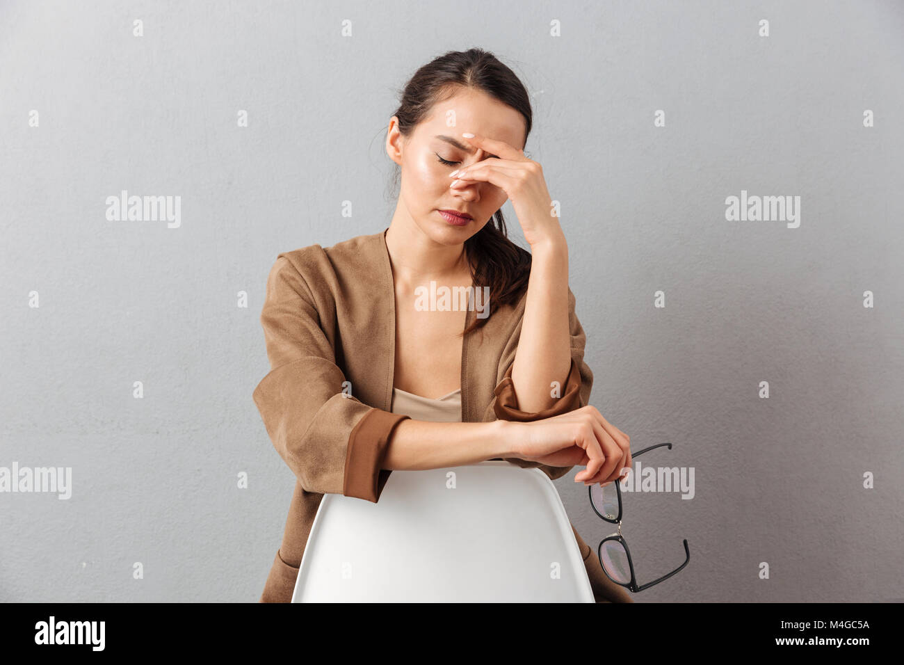 Business people lean on chair hi-res stock photography and images - Alamy