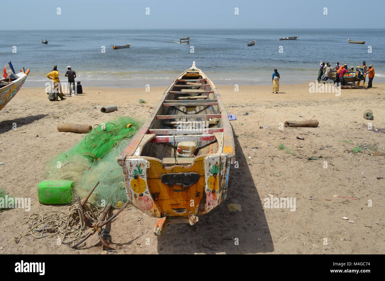 Artisanal wooden fishing boats (pirogues) in the Petite Côte, Senegal ...