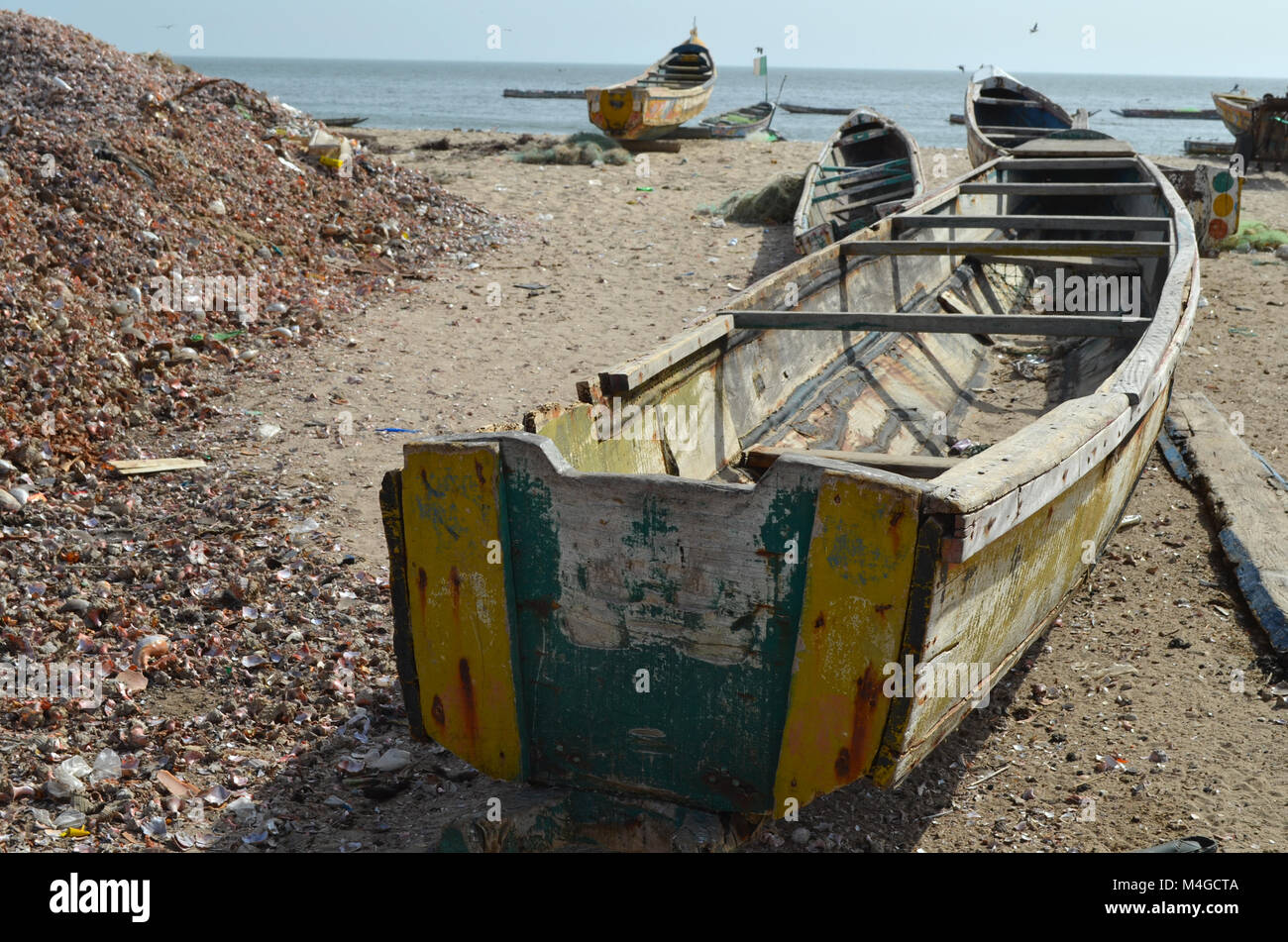 Artisanal wooden fishing boats (pirogues) in the Petite Côte, Senegal ...