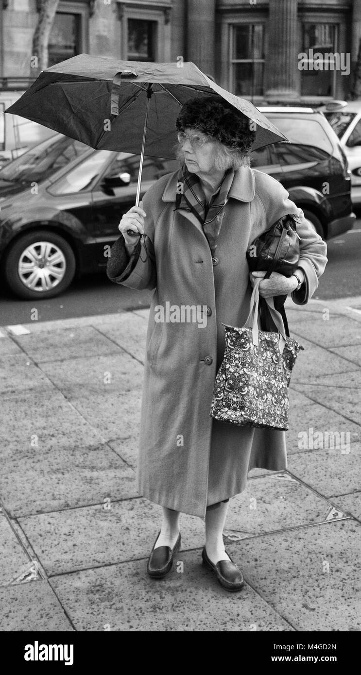 Black & White Photograph of an elderly lady with umbrella, London ...