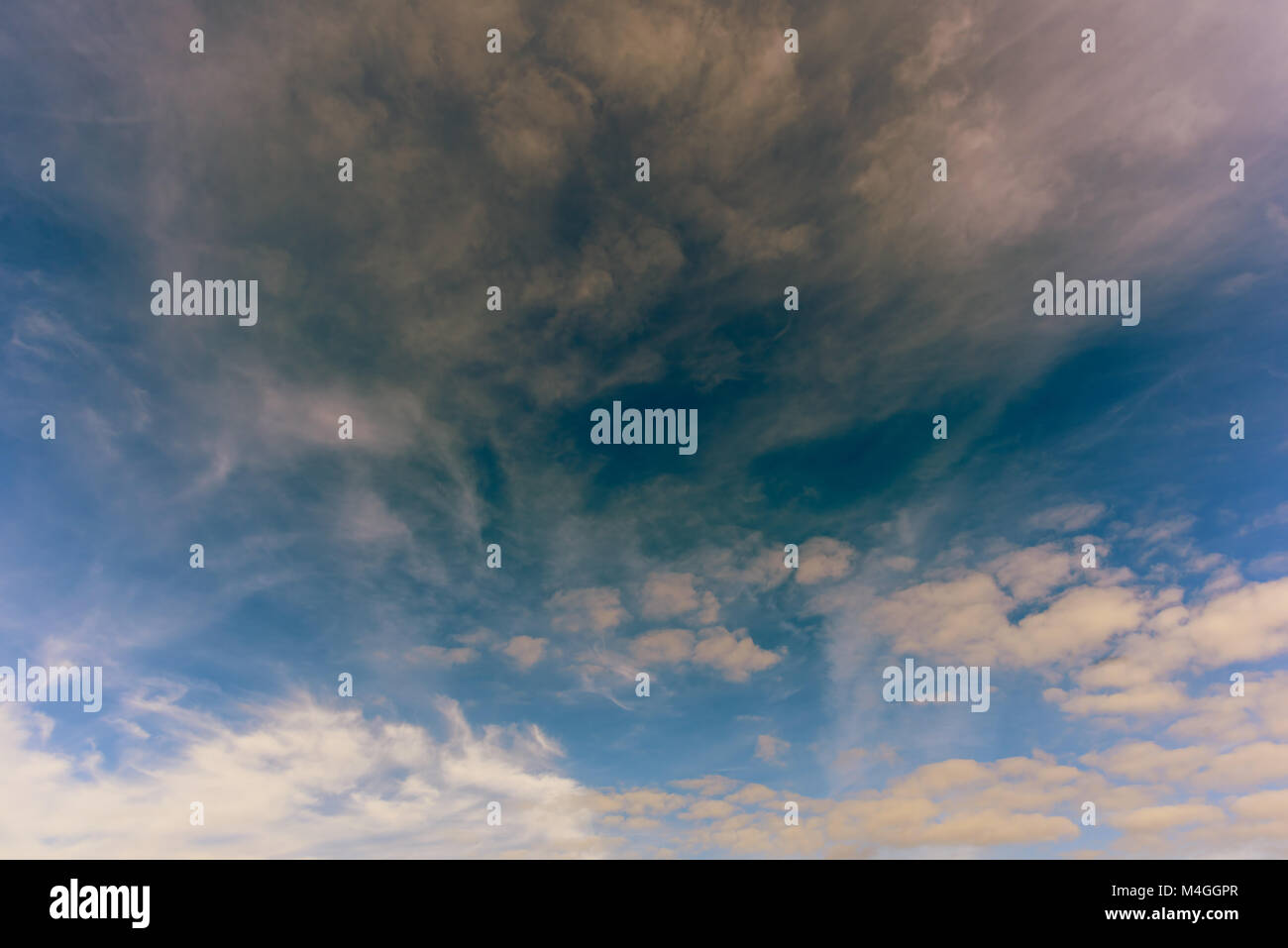 A huge, endless sky, illuminated by the rising sun, pink, blue, white ...