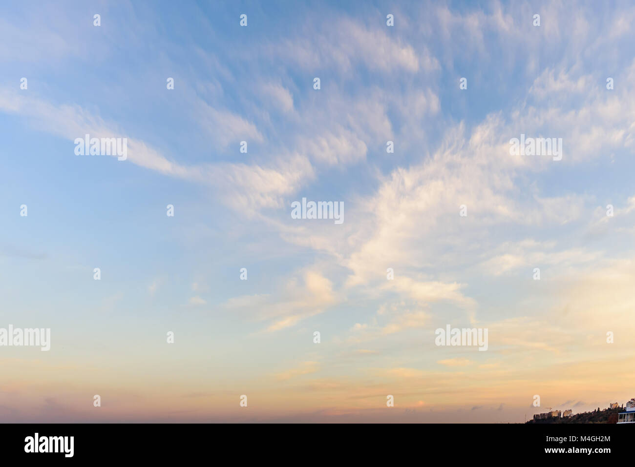 A huge, endless sky, illuminated by the rising sun, pink, blue, white ...