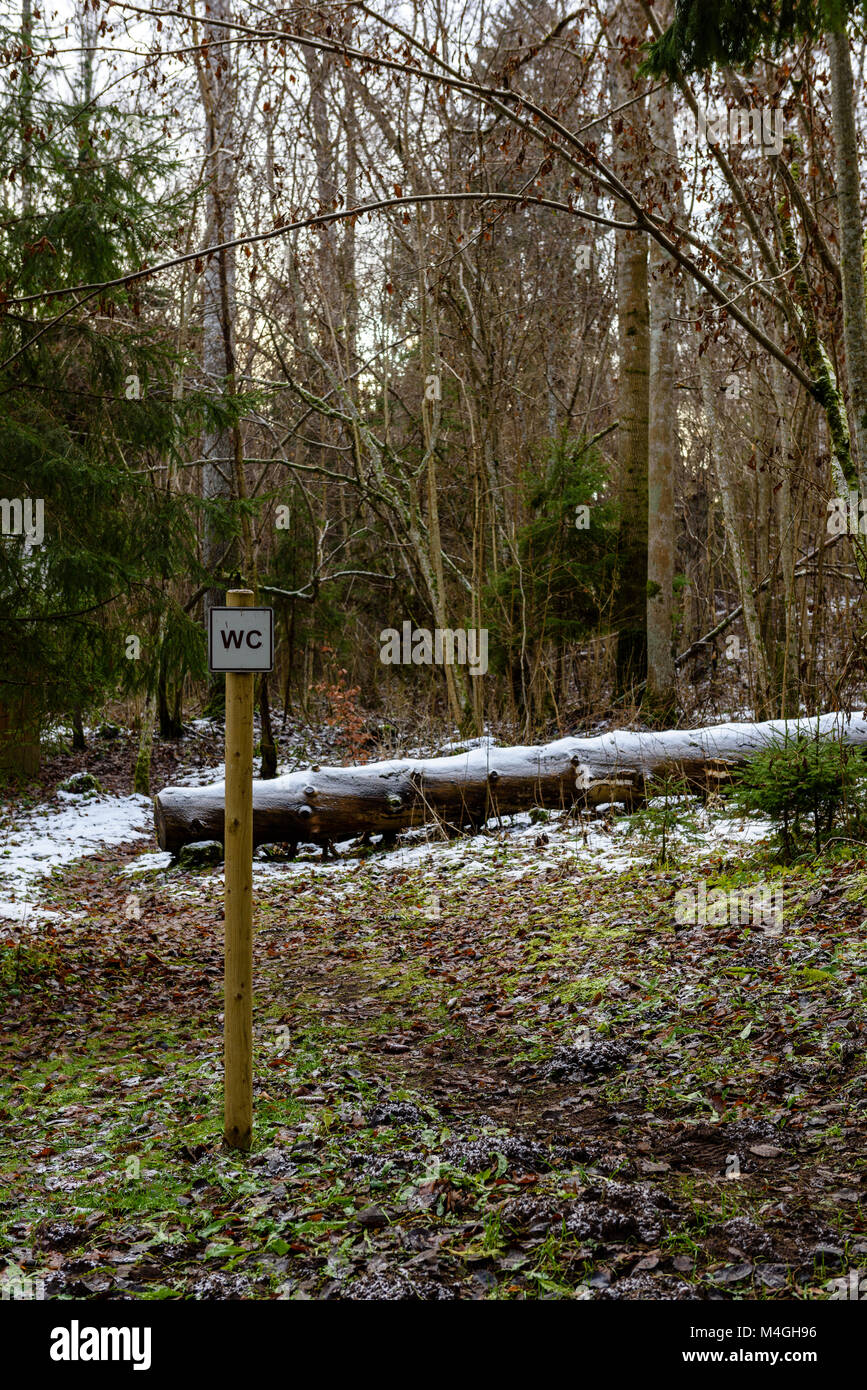 winter rural scene with road and sign showing direction in future Stock ...