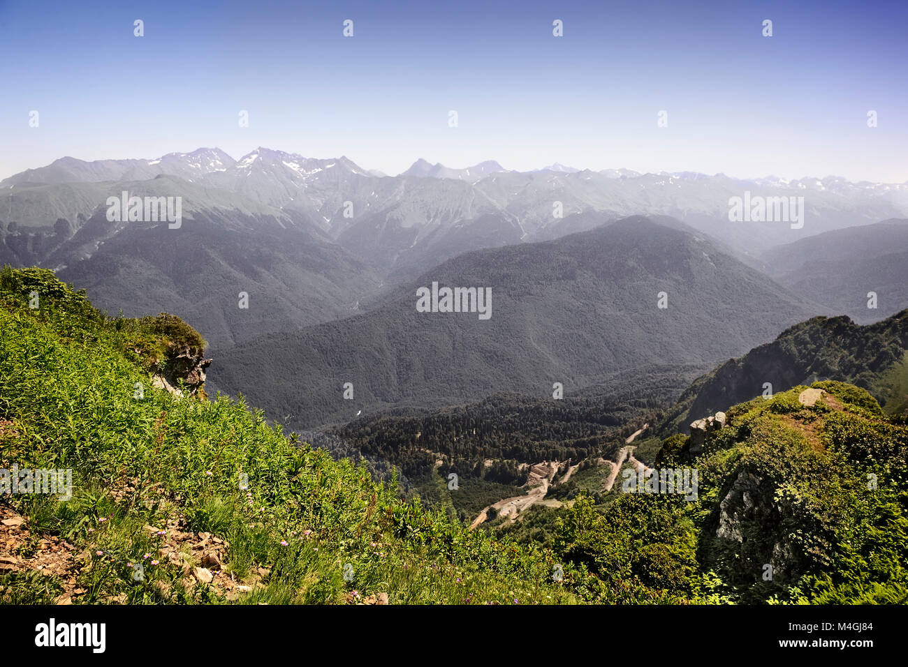 Mountain landscape: steep mountains covered with forests, form a deep ...