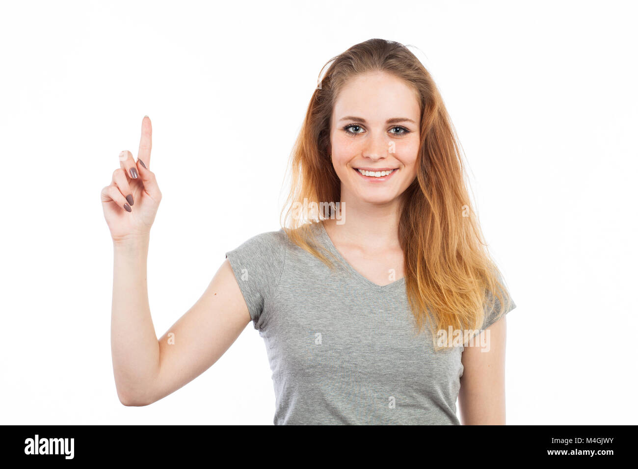 Portrait of an attractive woman pointing up, isolated on white Stock ...