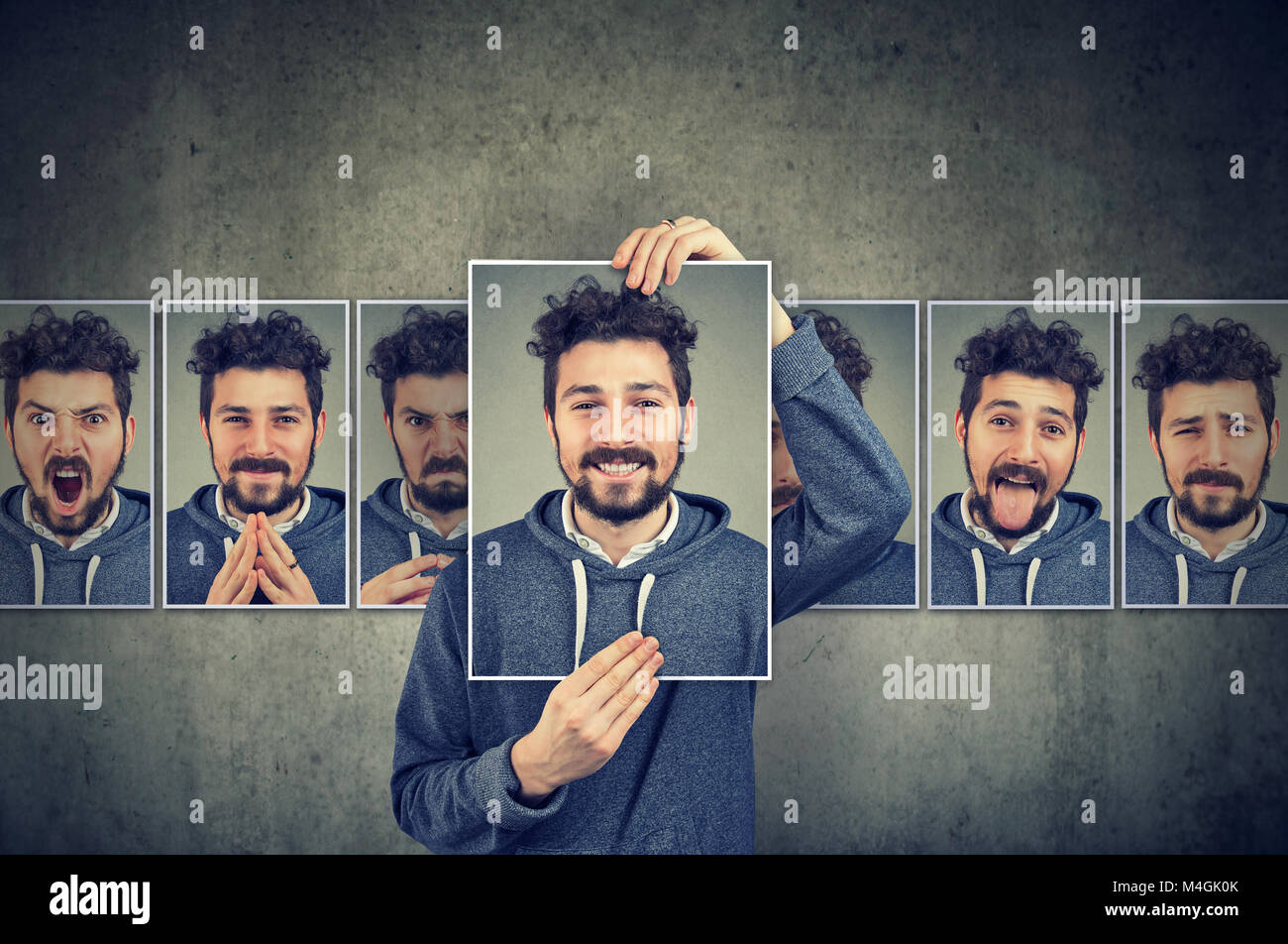 Positive masked young man in glasses expressing different emotions ...