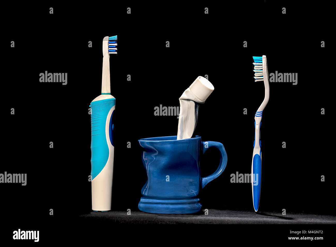 Traditional and modern toothbrush with pitcher with toothpaste isolated ...