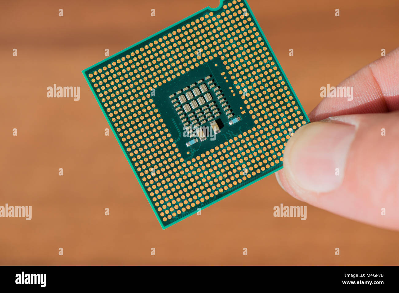 Computer CPU in closeup in front of wood background Stock Photo - Alamy