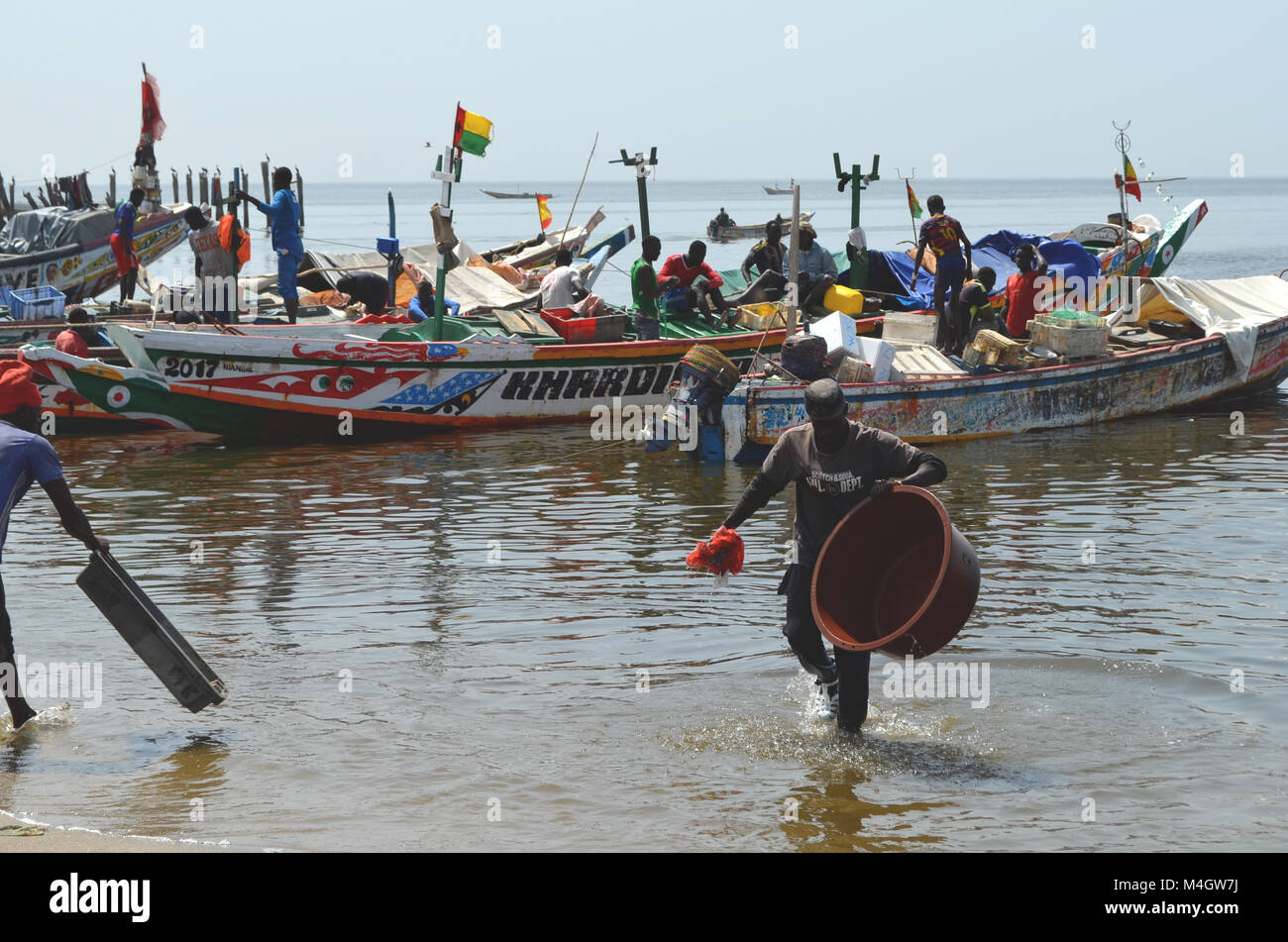 Artisanal wooden fishing boats (pirogues) in the Petite Côte, Senegal ...