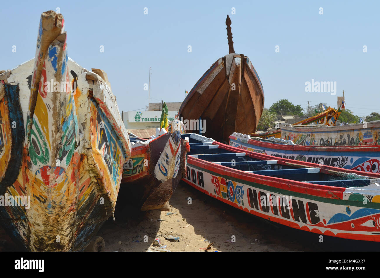 Artisanal wooden fishing boats (pirogues) in the Petite Côte, Senegal ...