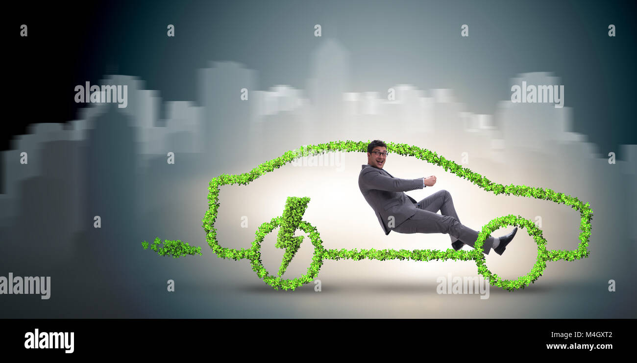 Electric car concept in green environment concept Stock Photo - Alamy