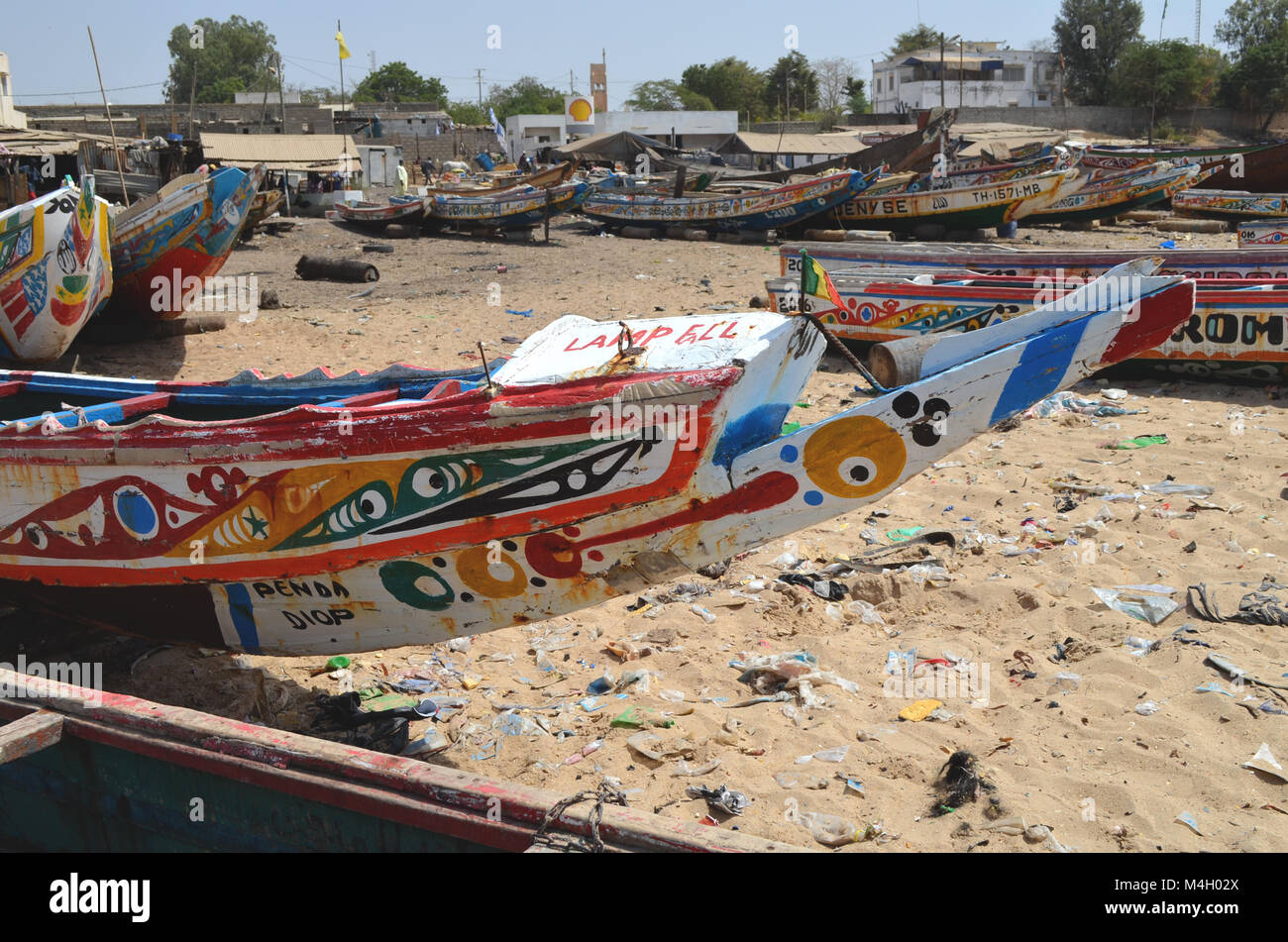 Artisanal wooden fishing boats (pirogues) in the Petite Côte, Senegal ...