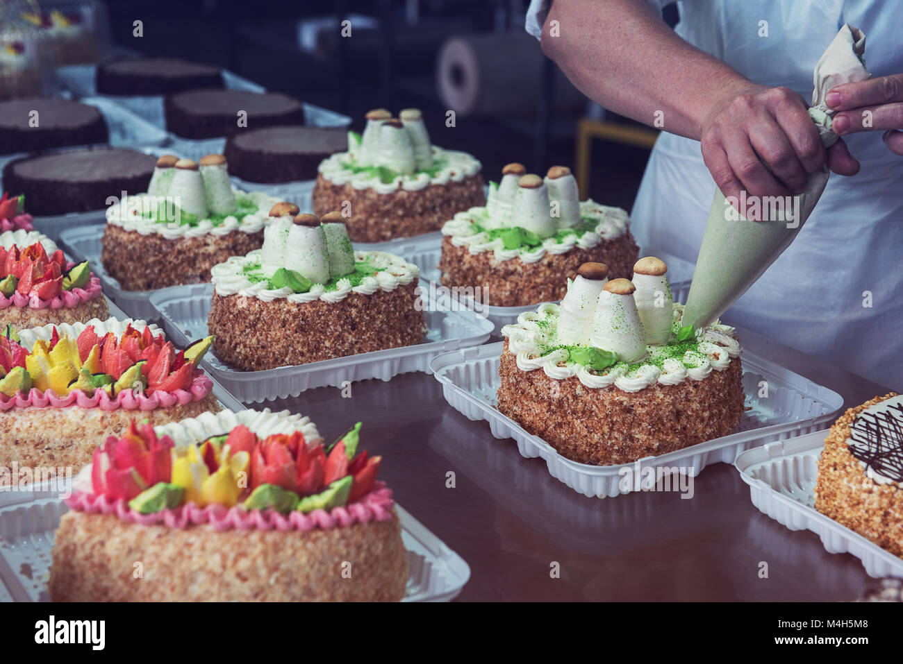 Manual cakes production Stock Photo - Alamy