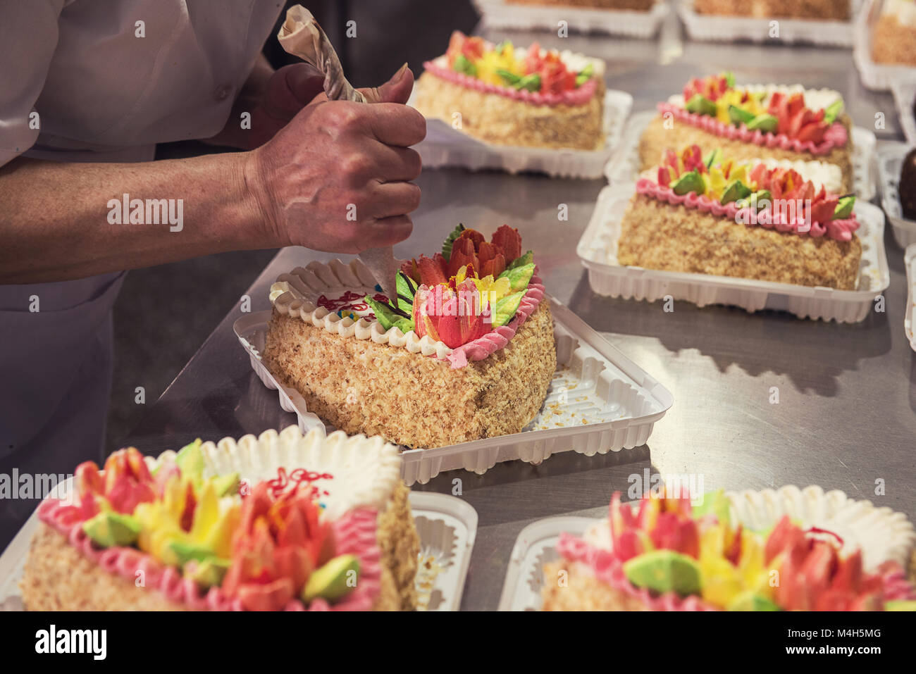 Manual cakes production Stock Photo - Alamy