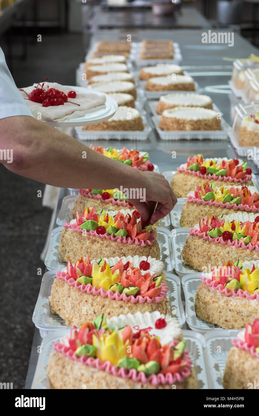 Manual cakes production Stock Photo - Alamy