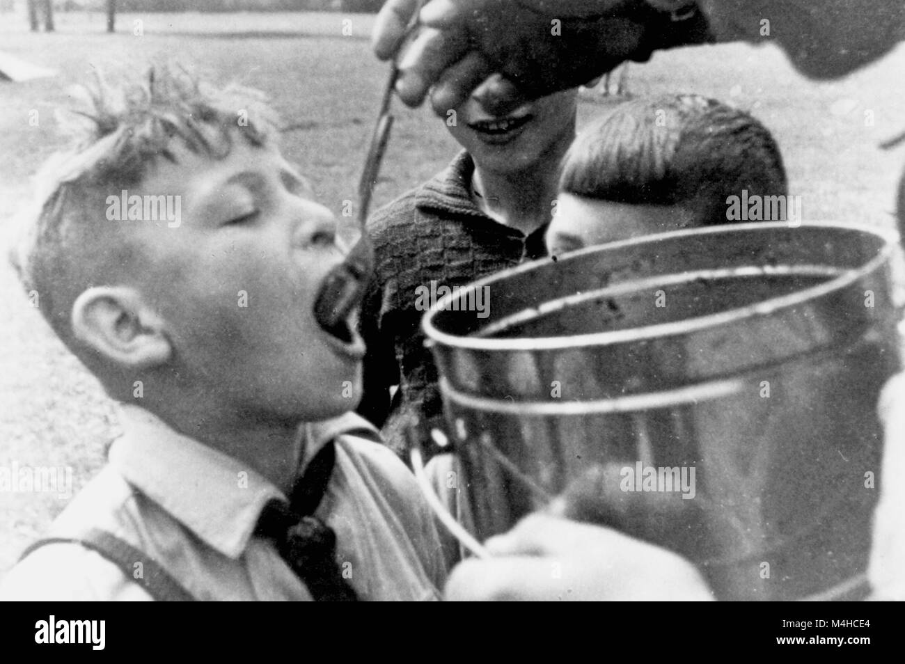 A Hitler Youth member eating in a tent camp in Ochsenfurt Stock Photo ...