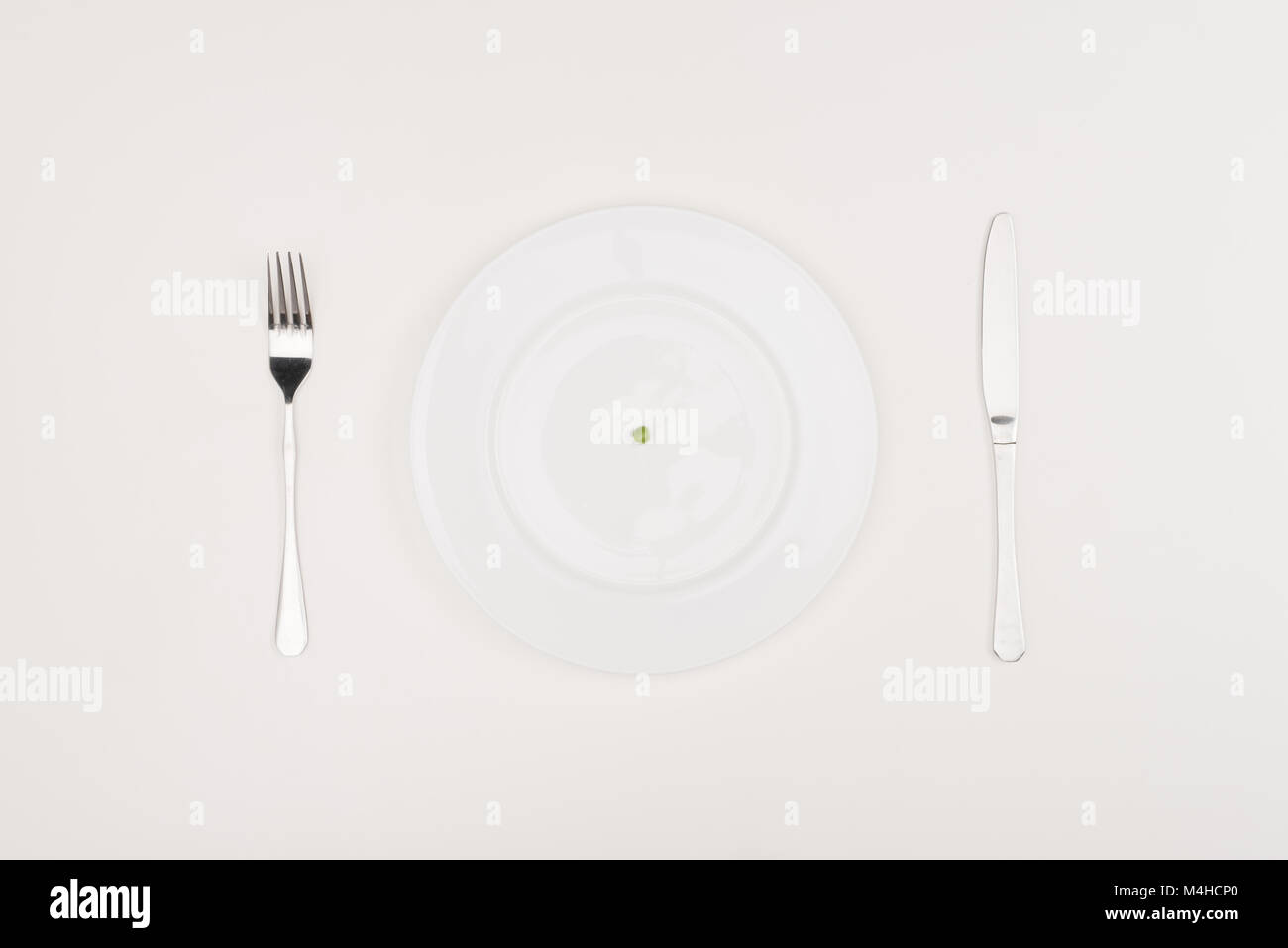 pea on plate, cutlery Stock Photo - Alamy