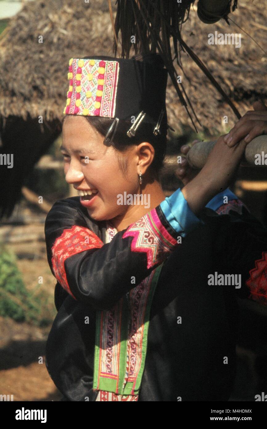 A young woman from the ethnic group Meo (Hmong) laughing in a village ...