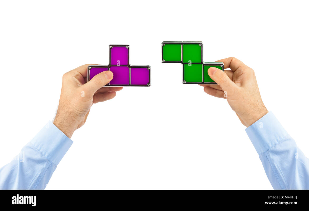 Hands with tetris toy blocks Stock Photo - Alamy