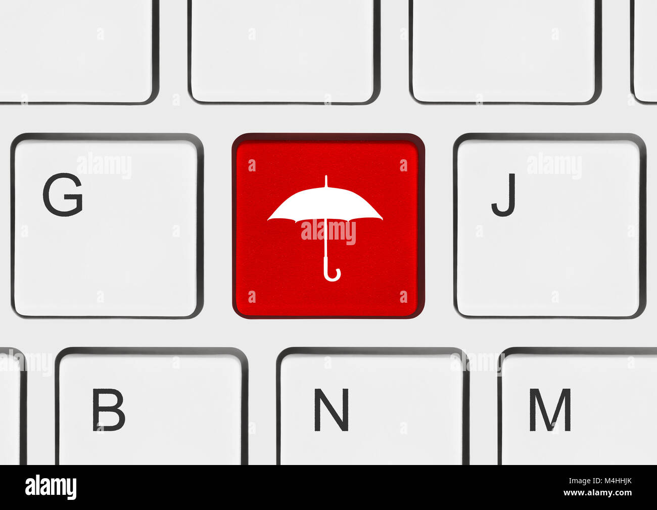 Computer keyboard with umbrella key Stock Photo - Alamy