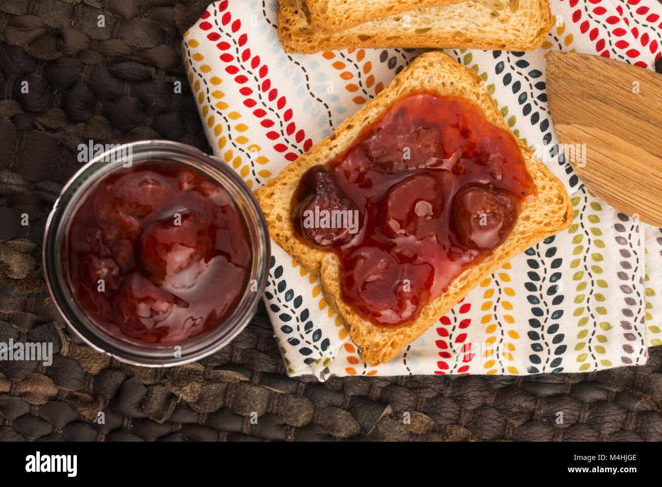 Breakfast of cherry jam on toast Stock Photo - Alamy