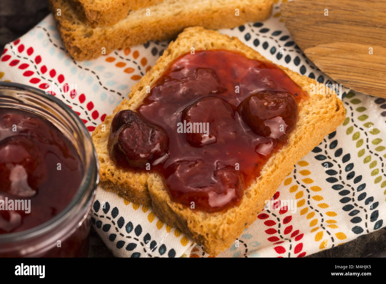Breakfast of cherry jam on toast Stock Photo - Alamy