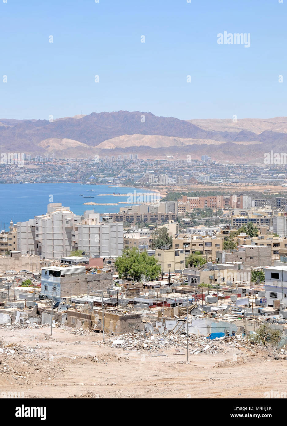 A panoramic view of Aqaba Jordan with the red sea and hills of Eilat in ...